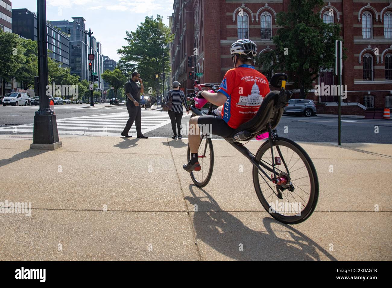 A person rides a bicycle during the 2022 Bike to Work Day in Washington ...