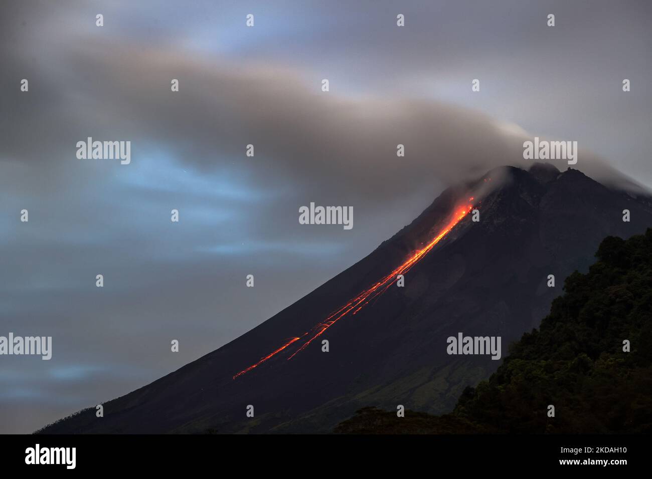Mount Merapi, a volcanic mountain spews lava as it erupts several times ...
