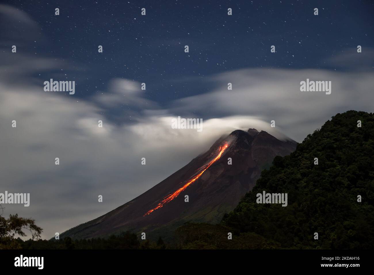 Mount Merapi, a volcanic mountain spews lava as it erupts several times ...