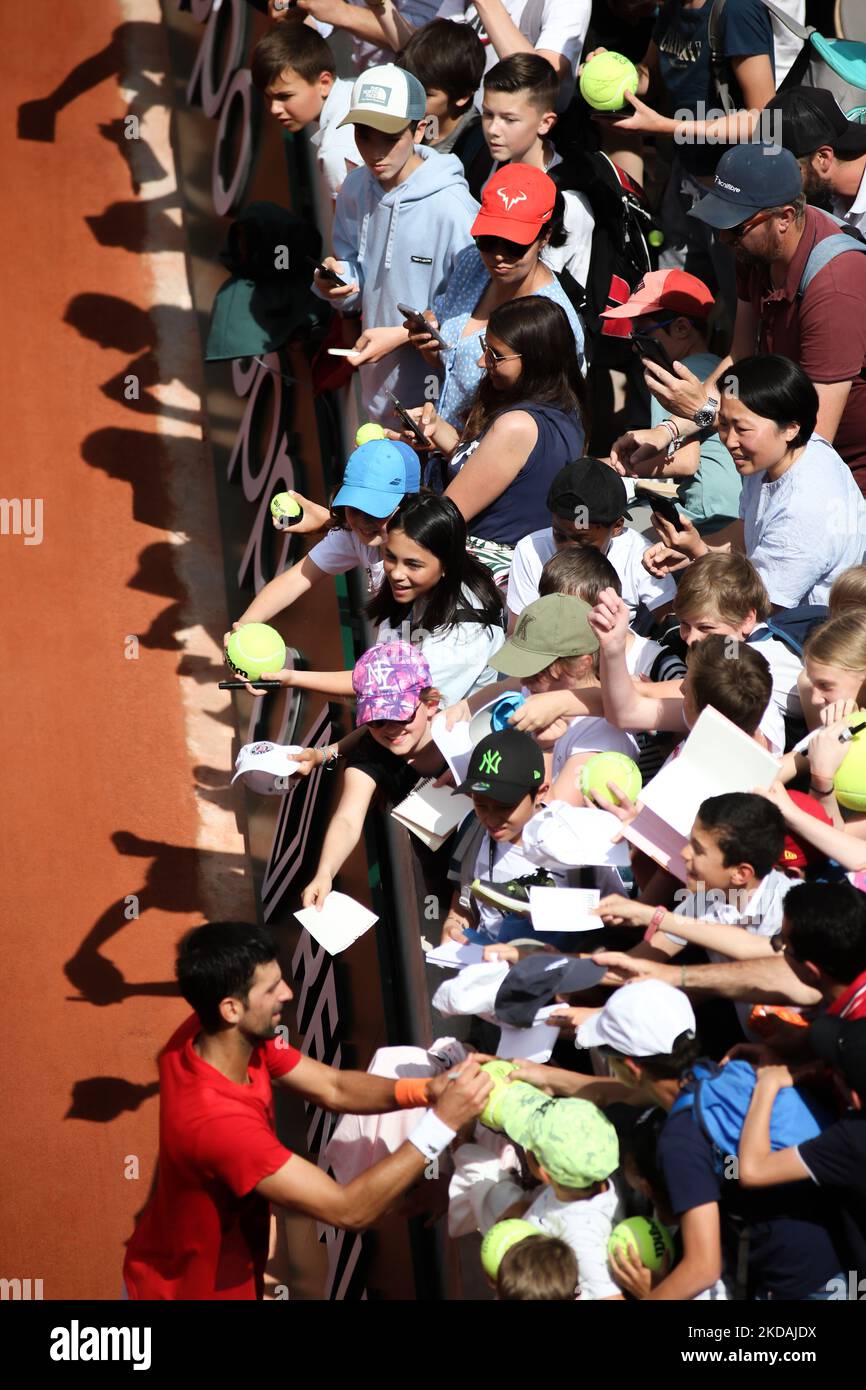 Novak Djokovic signing autographs for his fans during Roland Garros ...