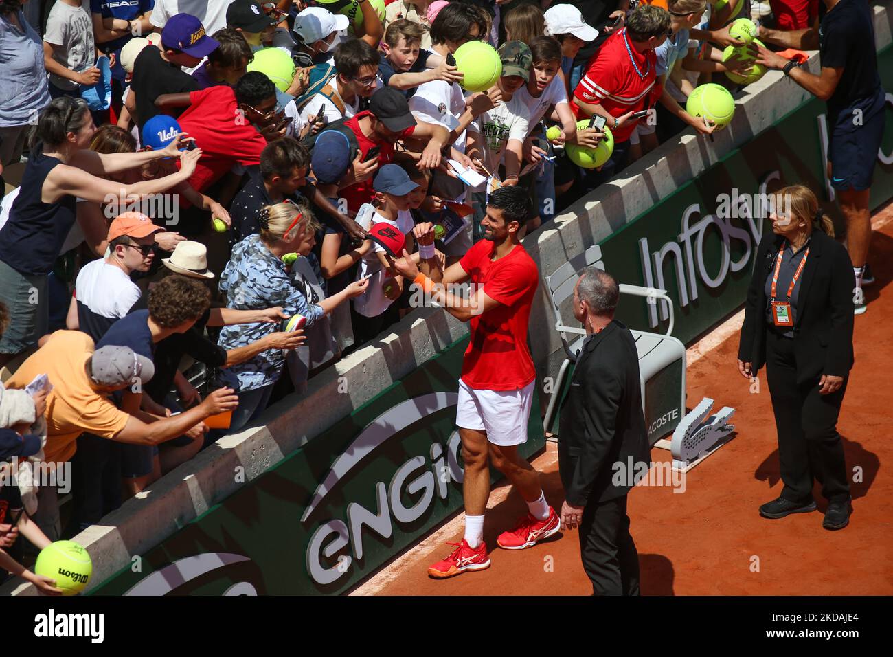 Novak Djokovic signing autographs for his fans during Roland Garros ...