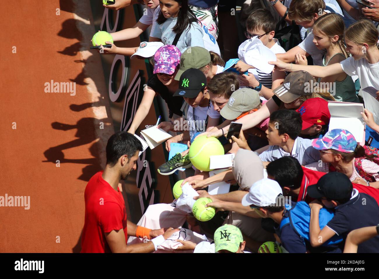 Novak Djokovic signing autographs for his fans during Roland Garros ...