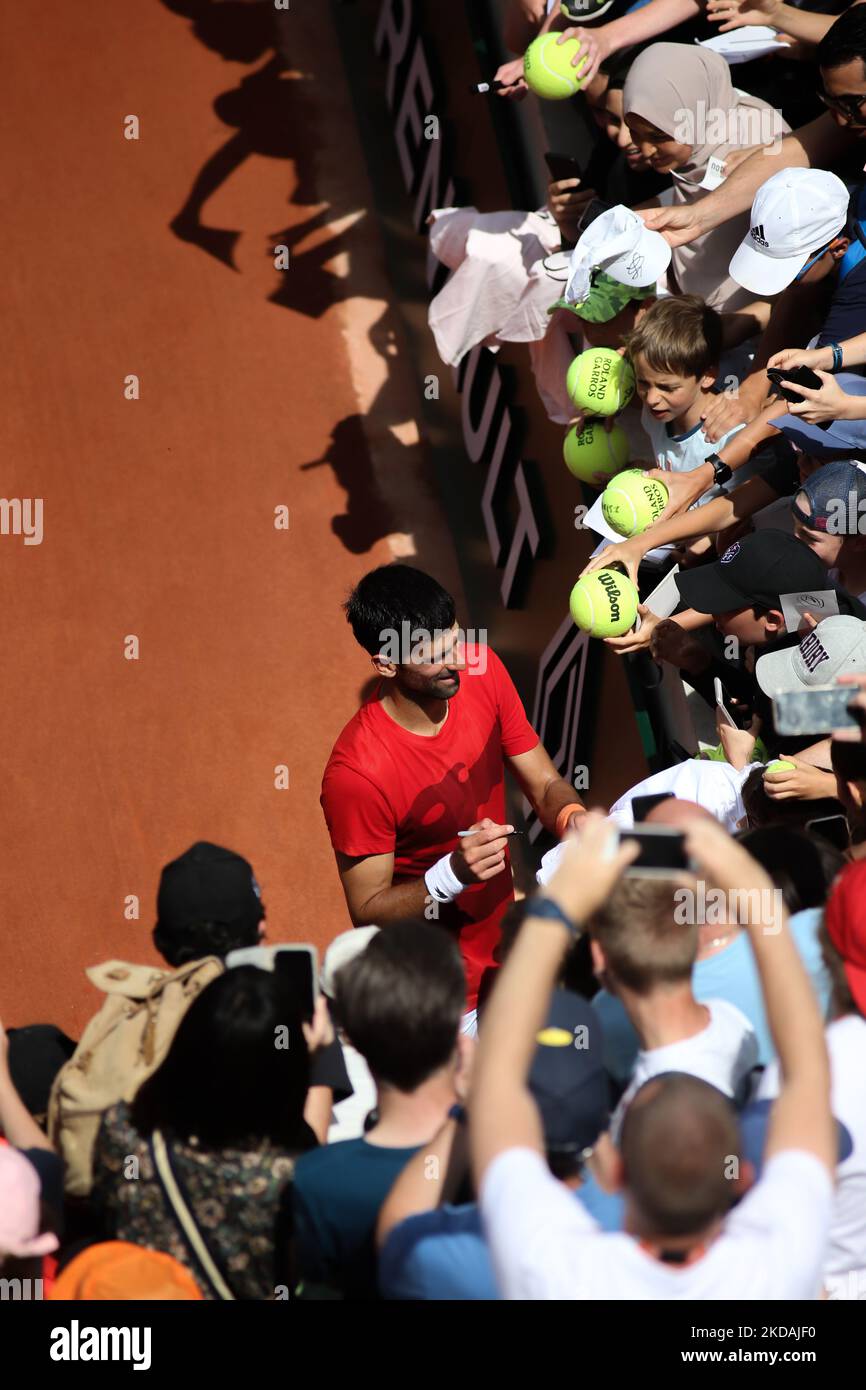 Novak Djokovic signing autographs for his fans during Roland Garros ...