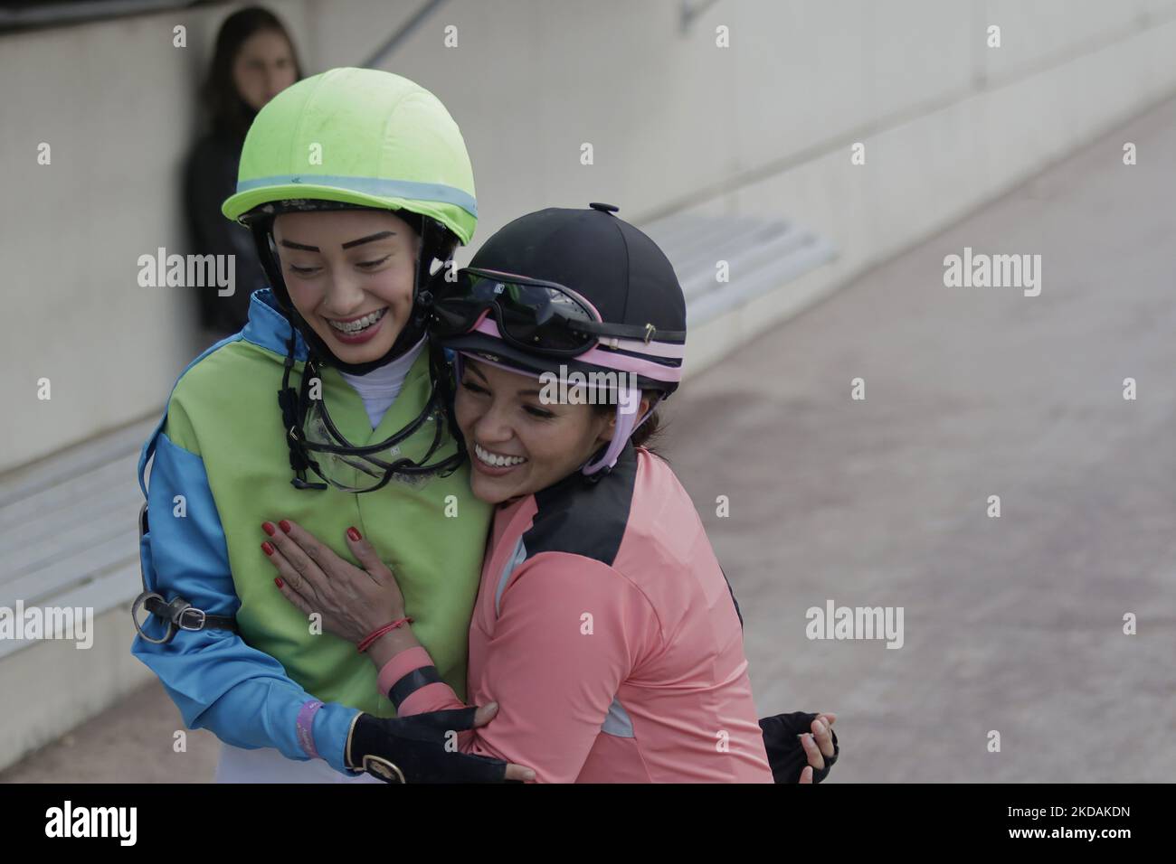 Fernanda Arteaga (left) and Dana Piña (right), jockeys, embrace during ...