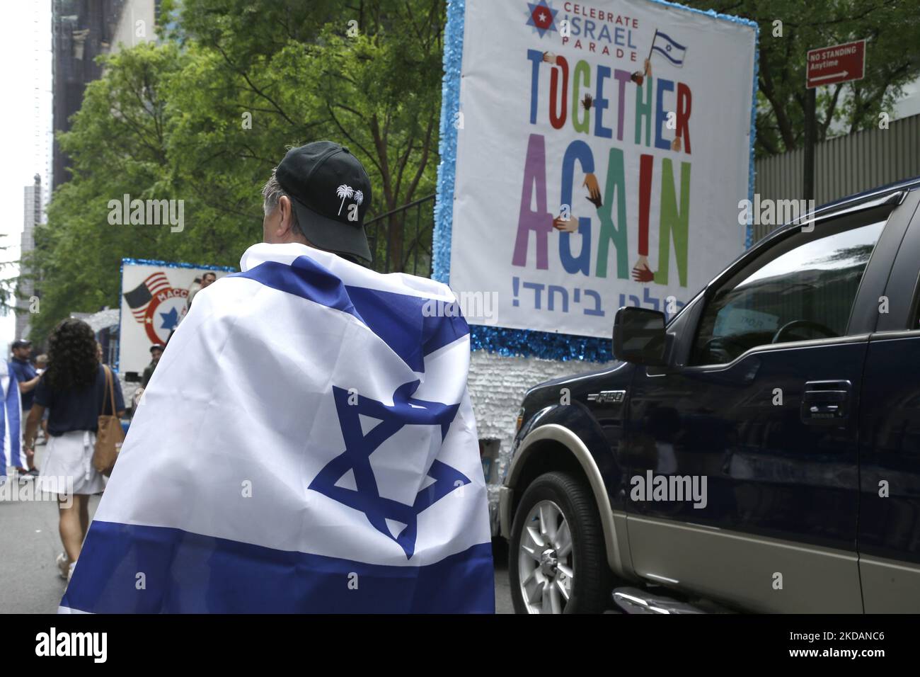 Demonstrators display banners and “End Jew Hatred” logos during the ...