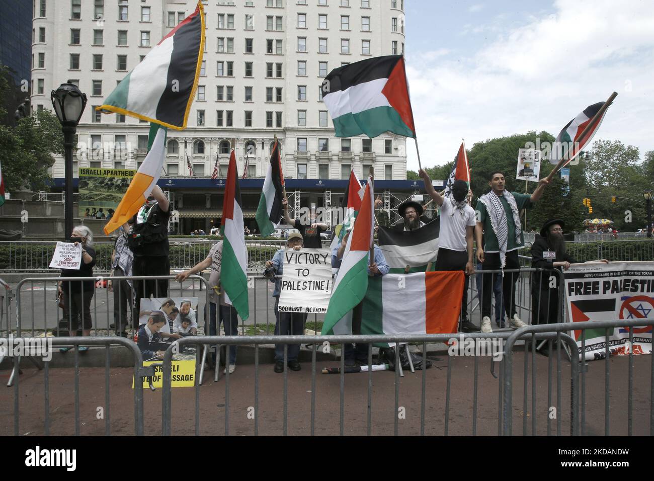 Palestinians rally as demonstrators display banners and “End Jew Hatred ...