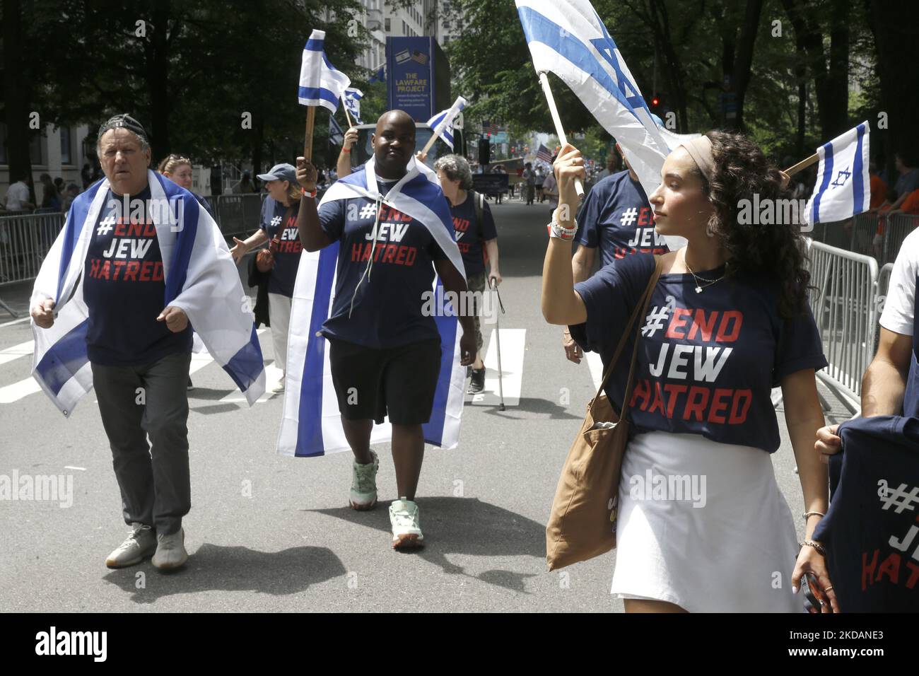 Demonstrators display banners and “End Jew Hatred” logos during the ...