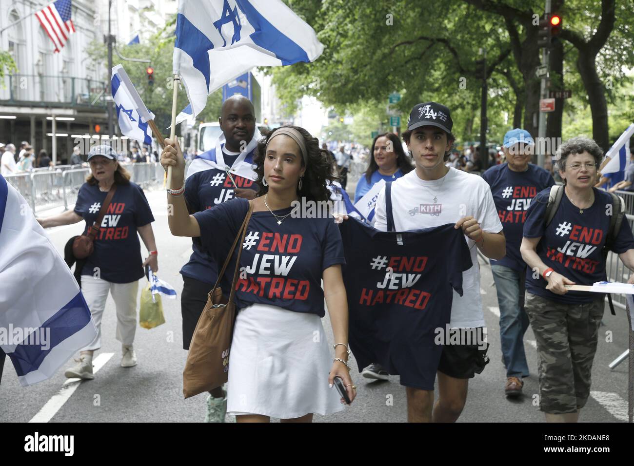 Demonstrators display banners and “End Jew Hatred” logos during the ...