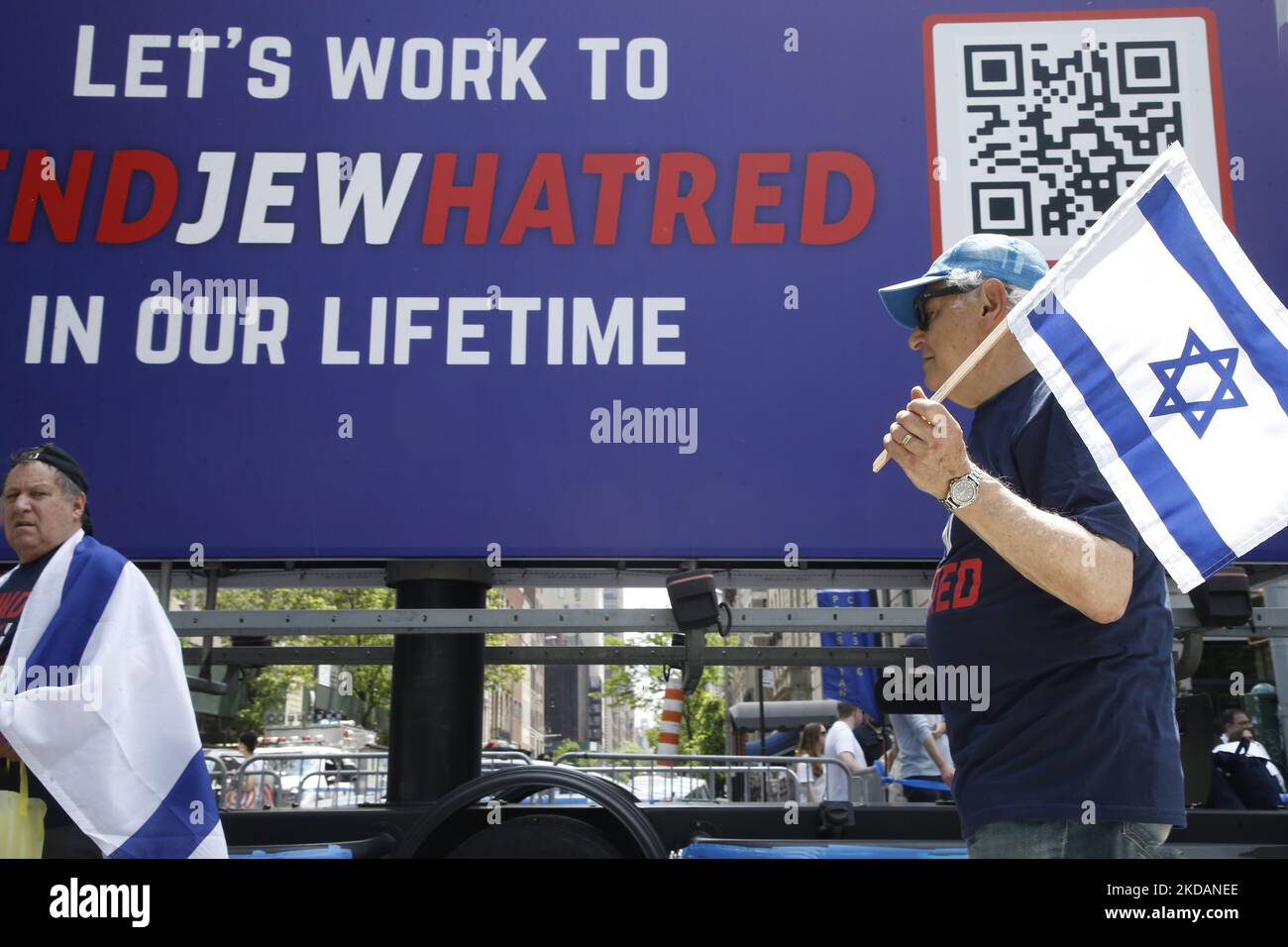 Demonstrators display banners and “End Jew Hatred” logos during the ...