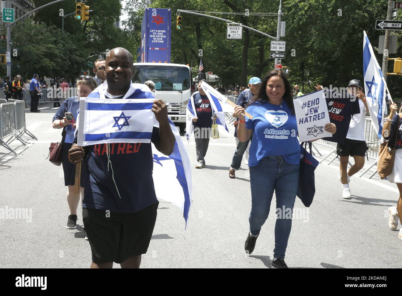 Demonstrators display banners and “End Jew Hatred” logos during the ...