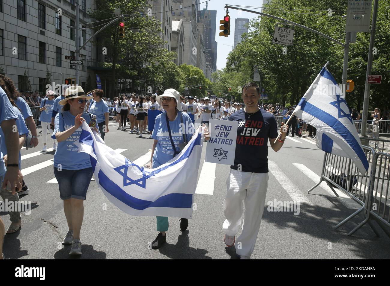 Yuval David marches along with demonstrators displaying banners and ...