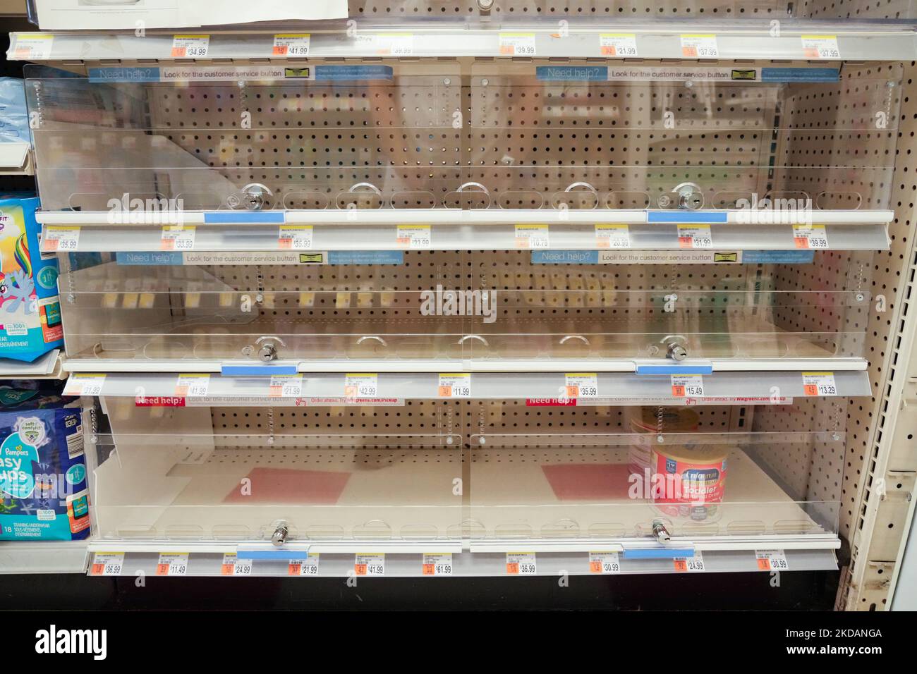 Nearly empty shelves in the baby formula aisle of a grocery store in ...