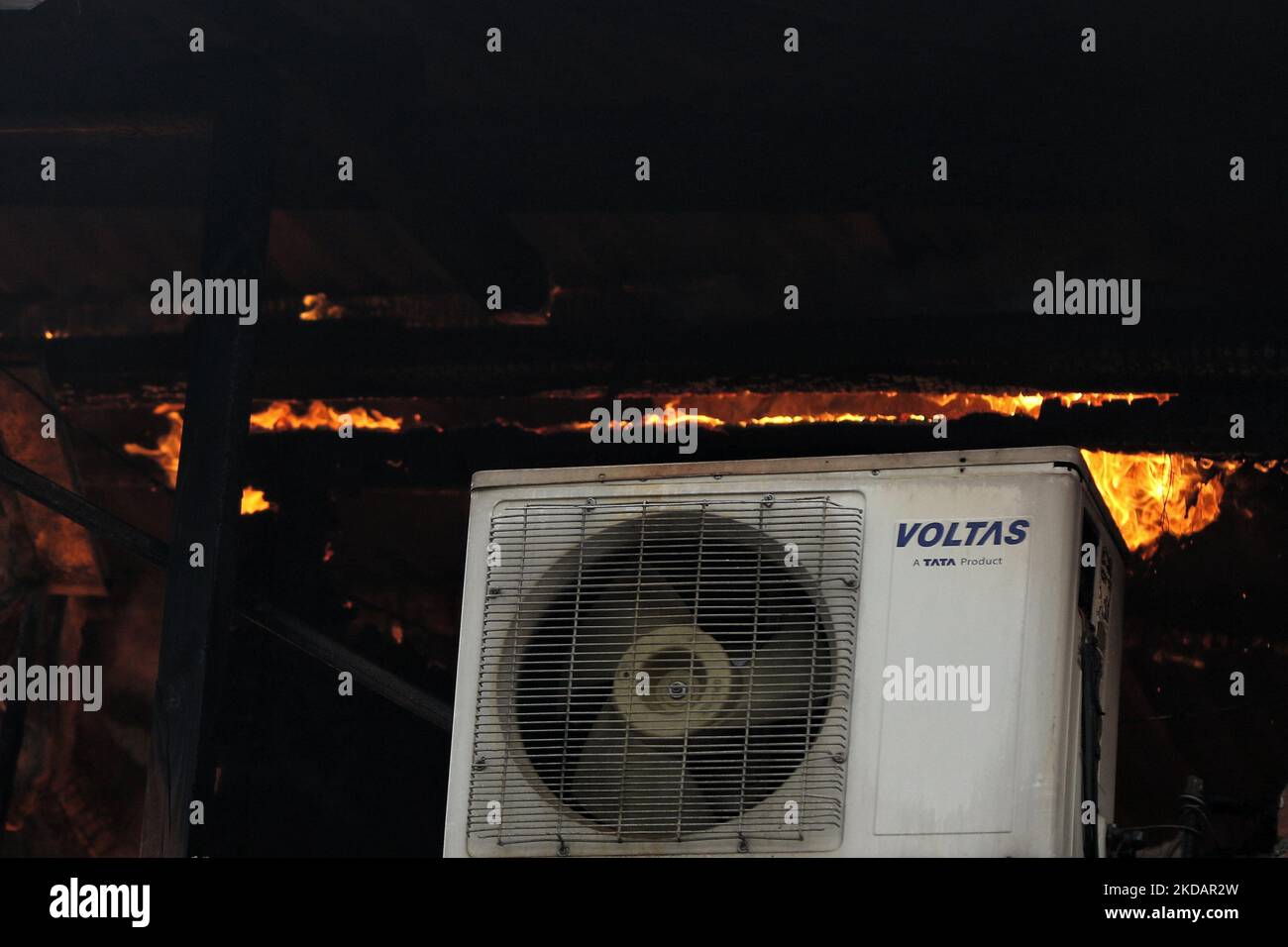 A Voltas Air Conditioner is seen as fire Gutted a building in Sopore ...