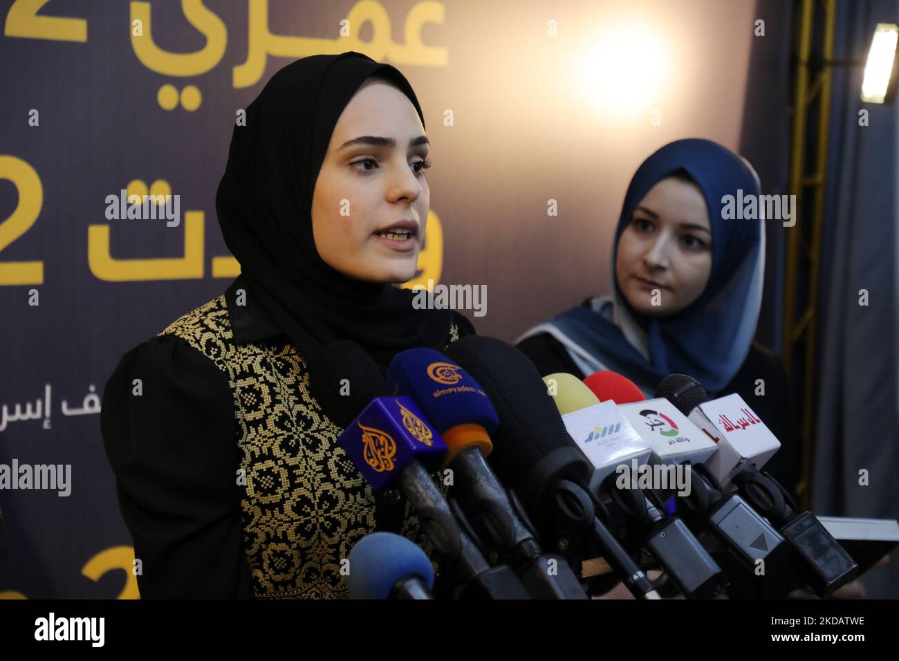 Palstinians attend the opening of an art gallery of Zainab al-Qolaq, a ...