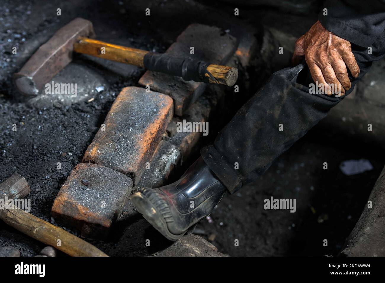 Tools are seen as Supardi Seswowarsito, 71, makes a traditional ...