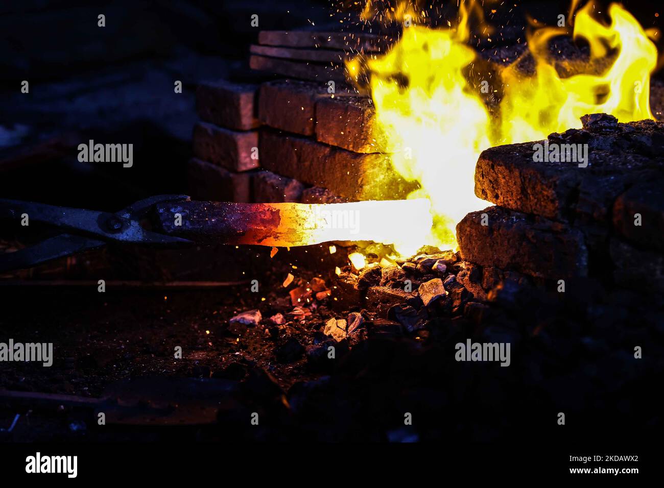 Ki Empu Sungkowo Harumbrodjo, 68, heats a dagger as he makes a ...