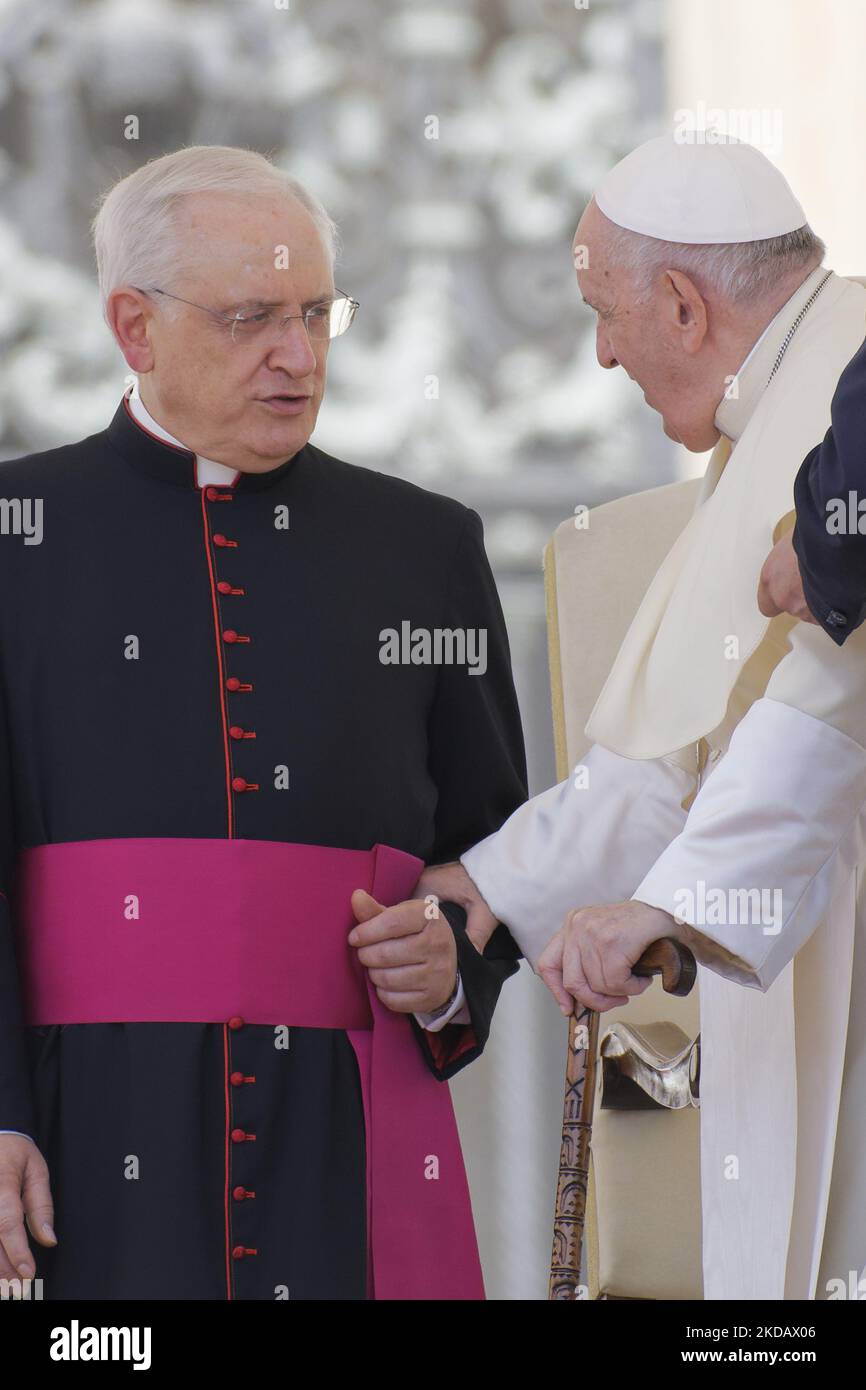 Pope Francis uses a walking stick as he arrives for his weekly general ...