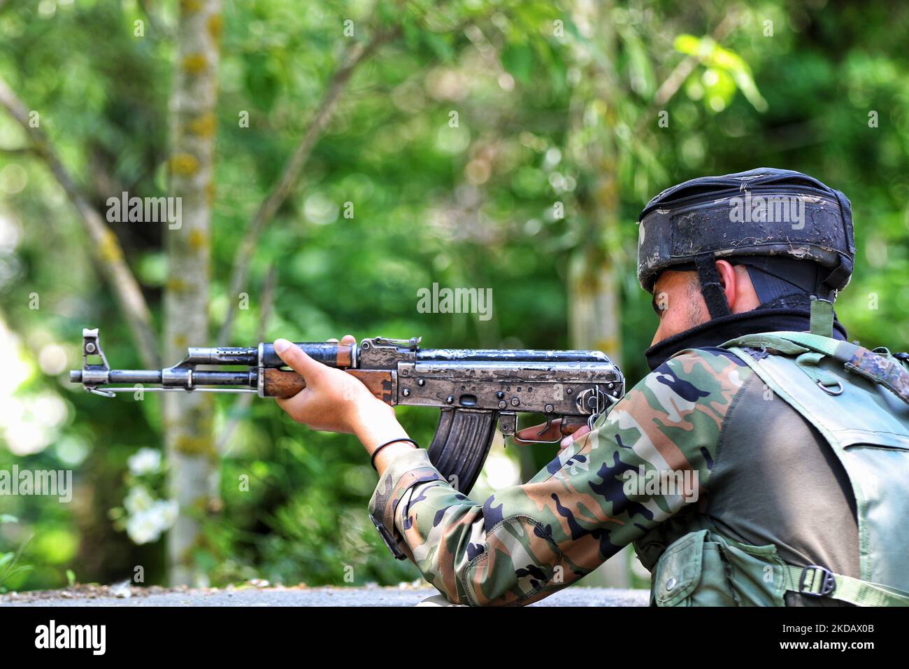A Jammu and Kashmir Police Cop JKP takes position during an encounter ...