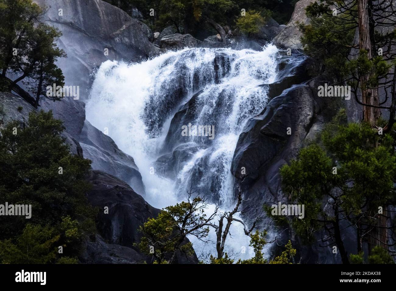 A natural view of a beautiful waterfall in a forest Stock Photo - Alamy