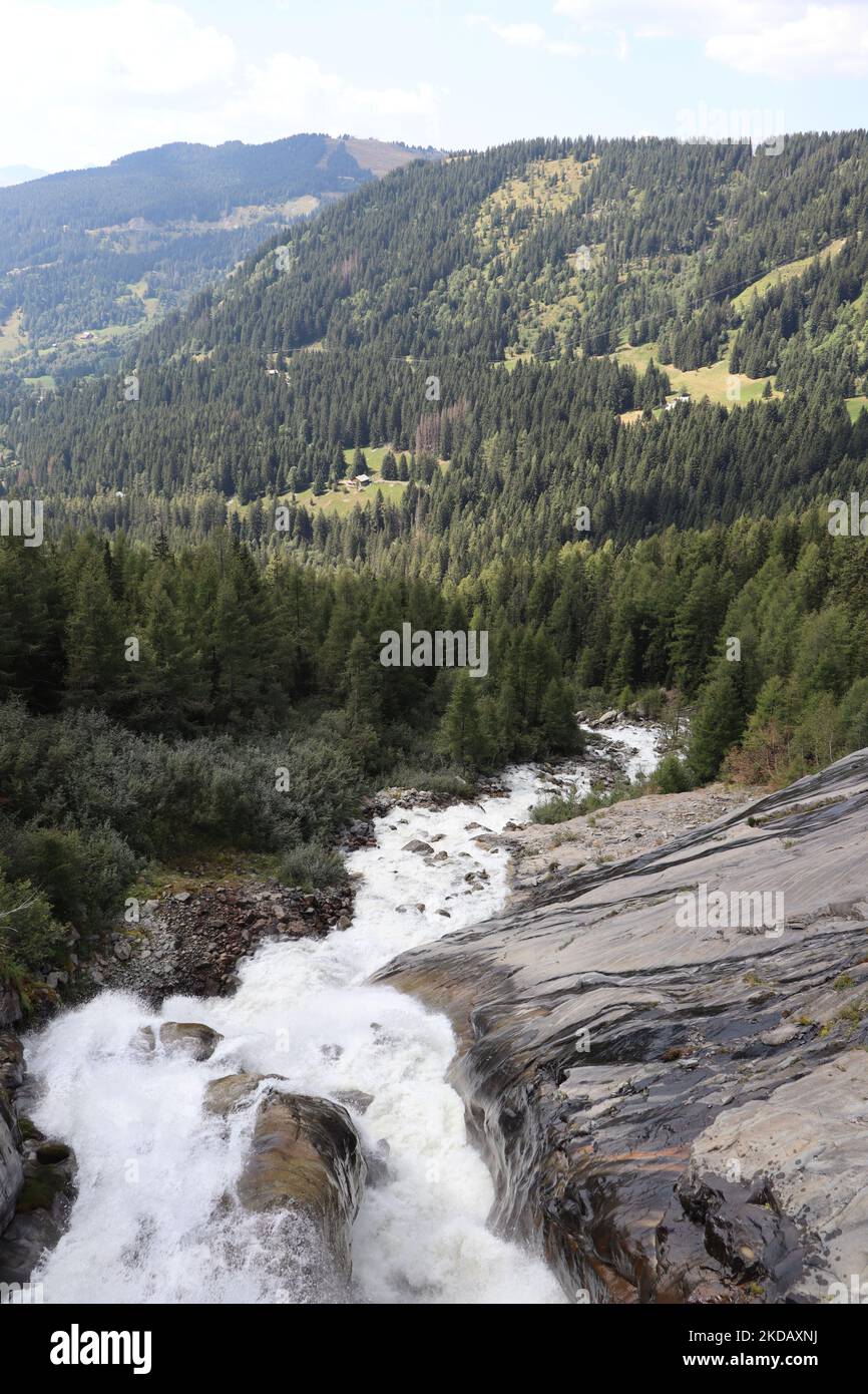 A vertical shot of a flowing splashing stream in the Mont Blanc ...