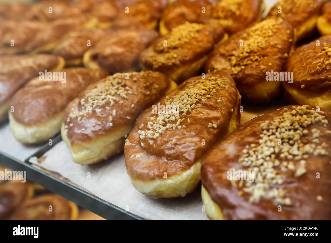 Filled doughnuts called Paczki are seen in a storefront in Krakow ...