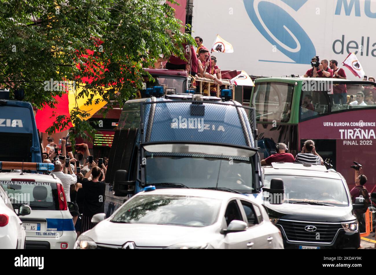 Two open-top As Roma coaches with the team and management on board left ...