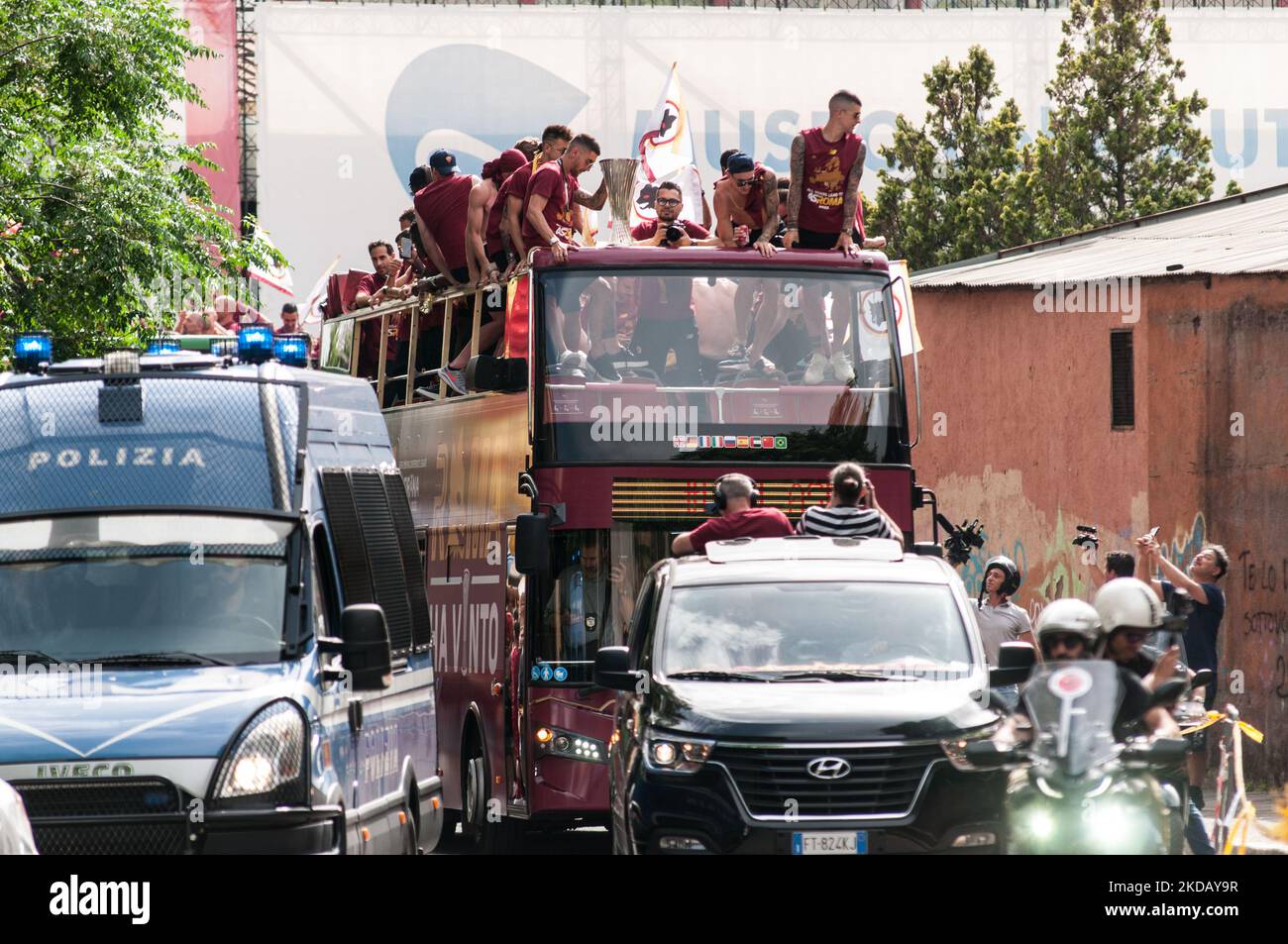 Two open-top As Roma coaches with the team and management on board left ...