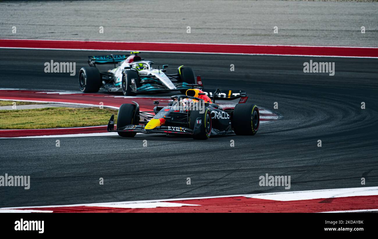 A competition between two racing cars of Lewis Hamilton and Max ...