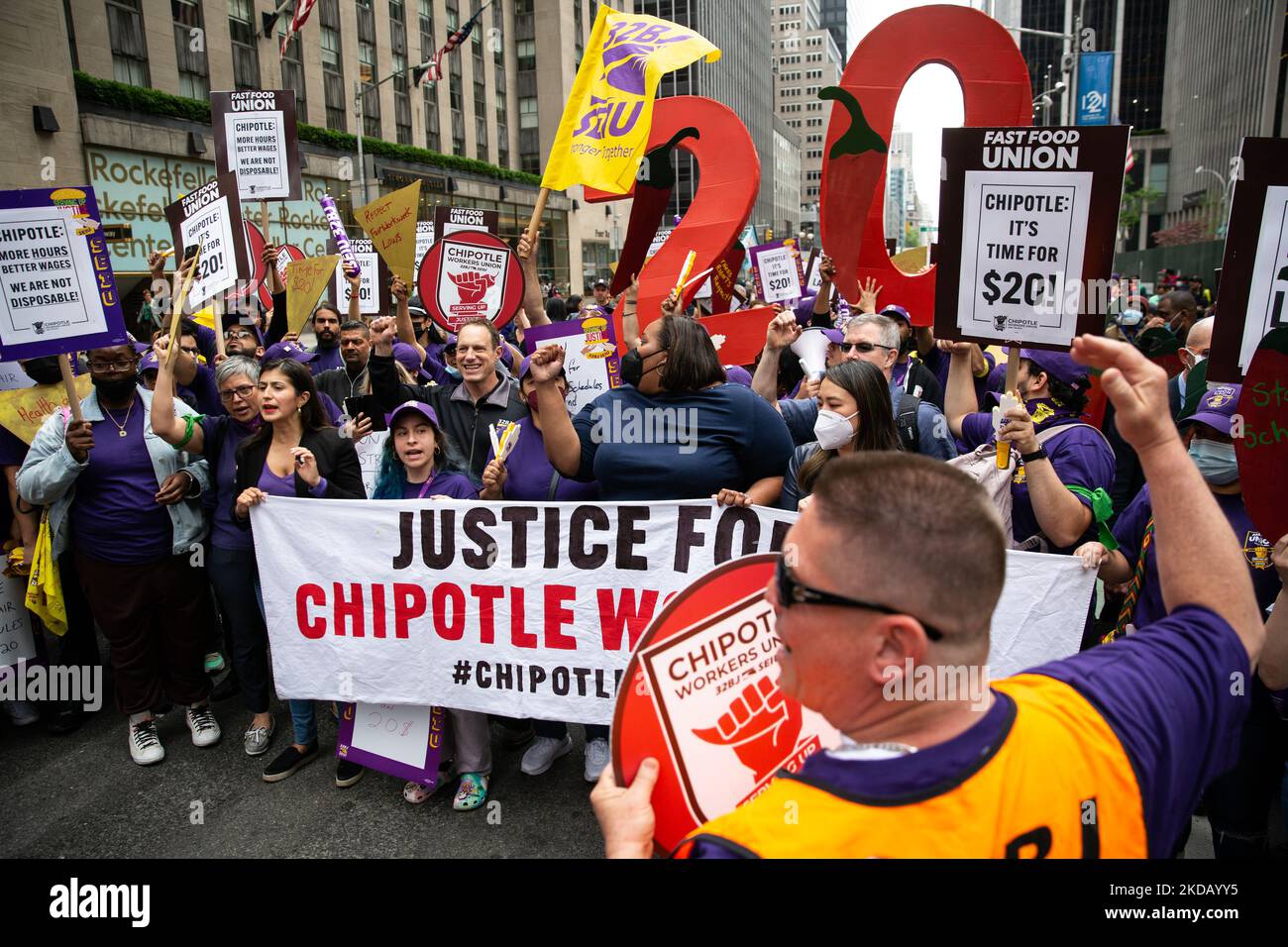 Current and former Chipotle workers marched with elected officials from ...