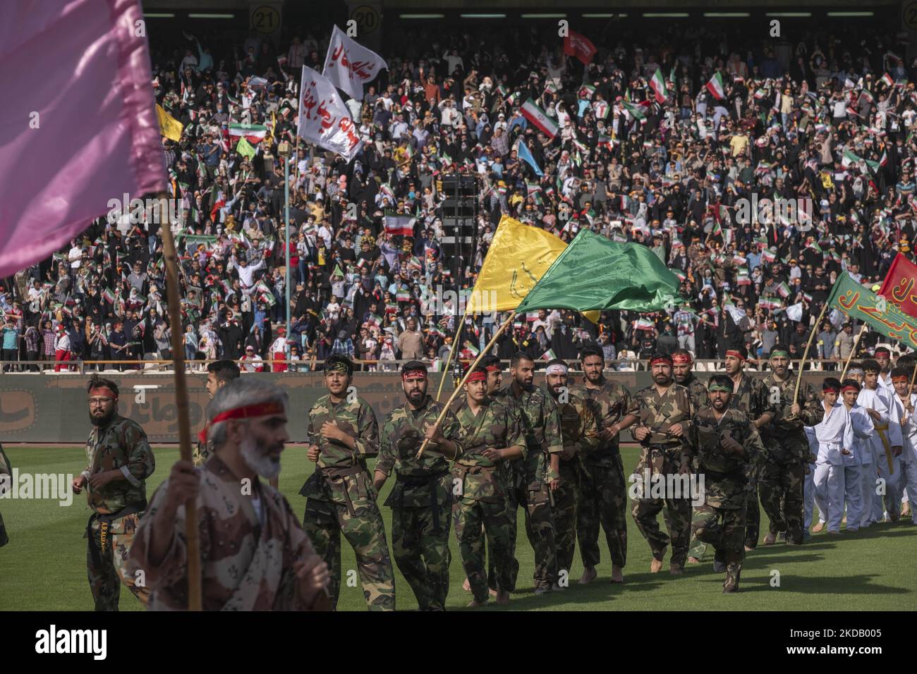 Members of the Iranian Basij paramilitary force carrying religious ...