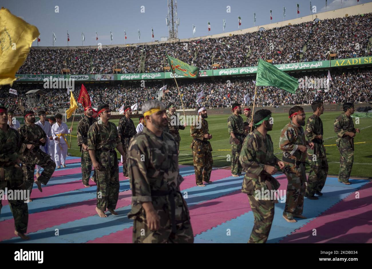 Members of the Iranian Basij paramilitary force carrying religious ...