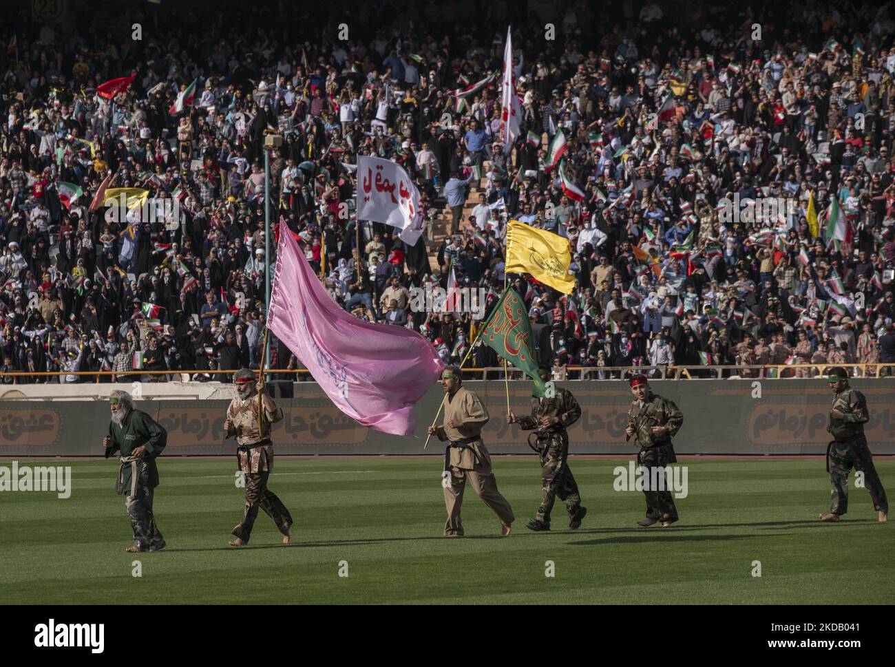 Members of the Iranian Basij paramilitary force carrying religious ...