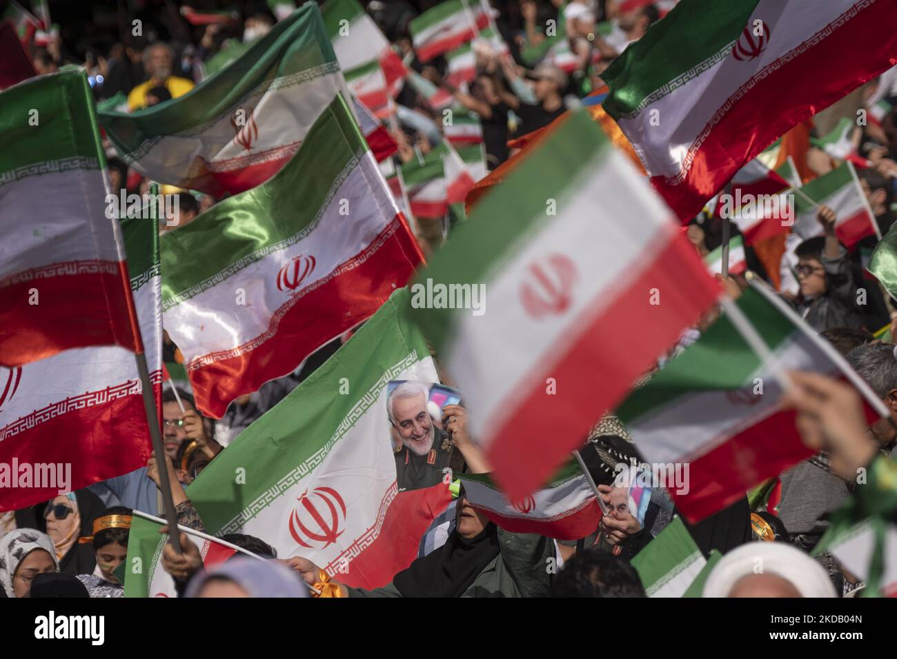 Supporters of Iran’s Supreme Leader Ayatollah Ali Khamenei wave Iranian ...