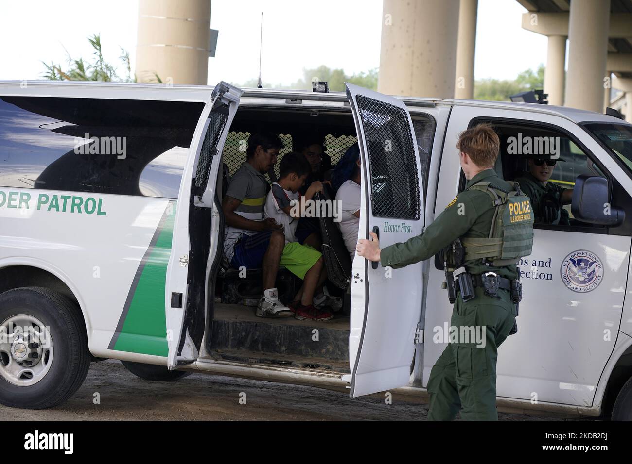 Migrants that crossed the Rio Grande are loaded into Border Patrol van ...