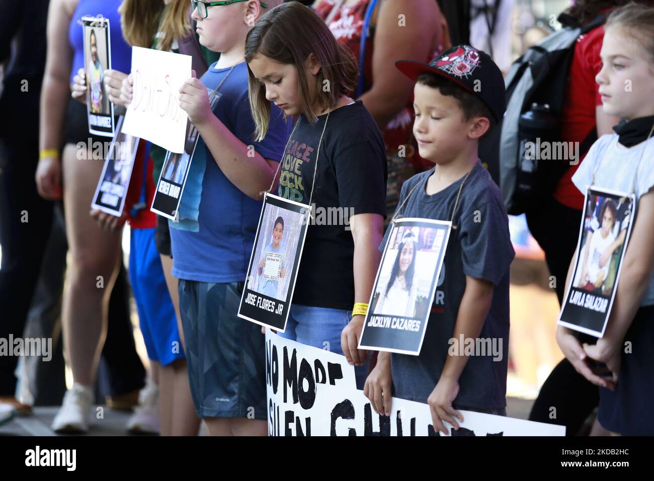 Children stand with signs at a protest against the NRA in Houston ...