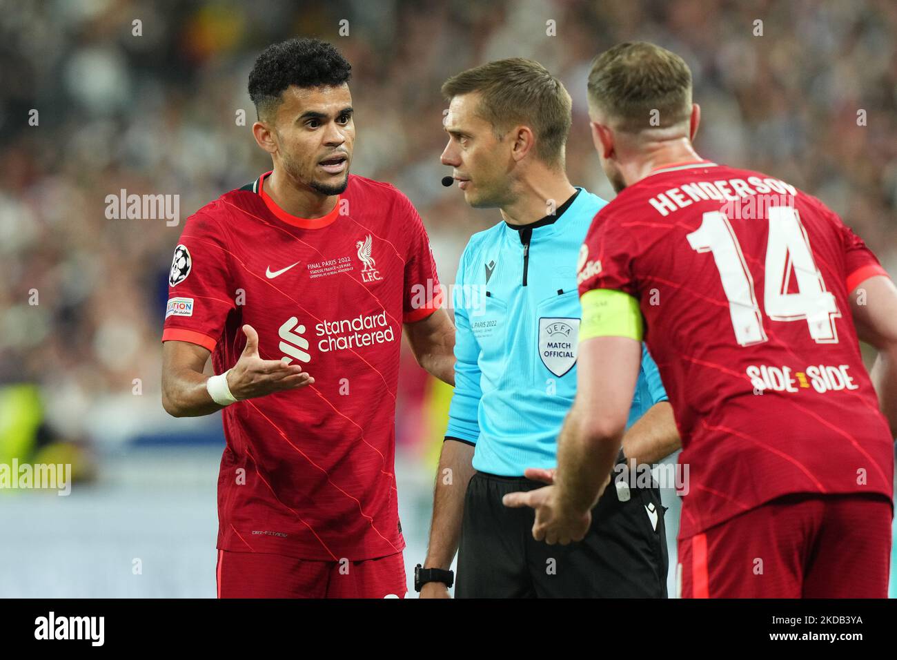 Referee Clement Turpin is confronted Luis Diaz of Liverpool FC during ...