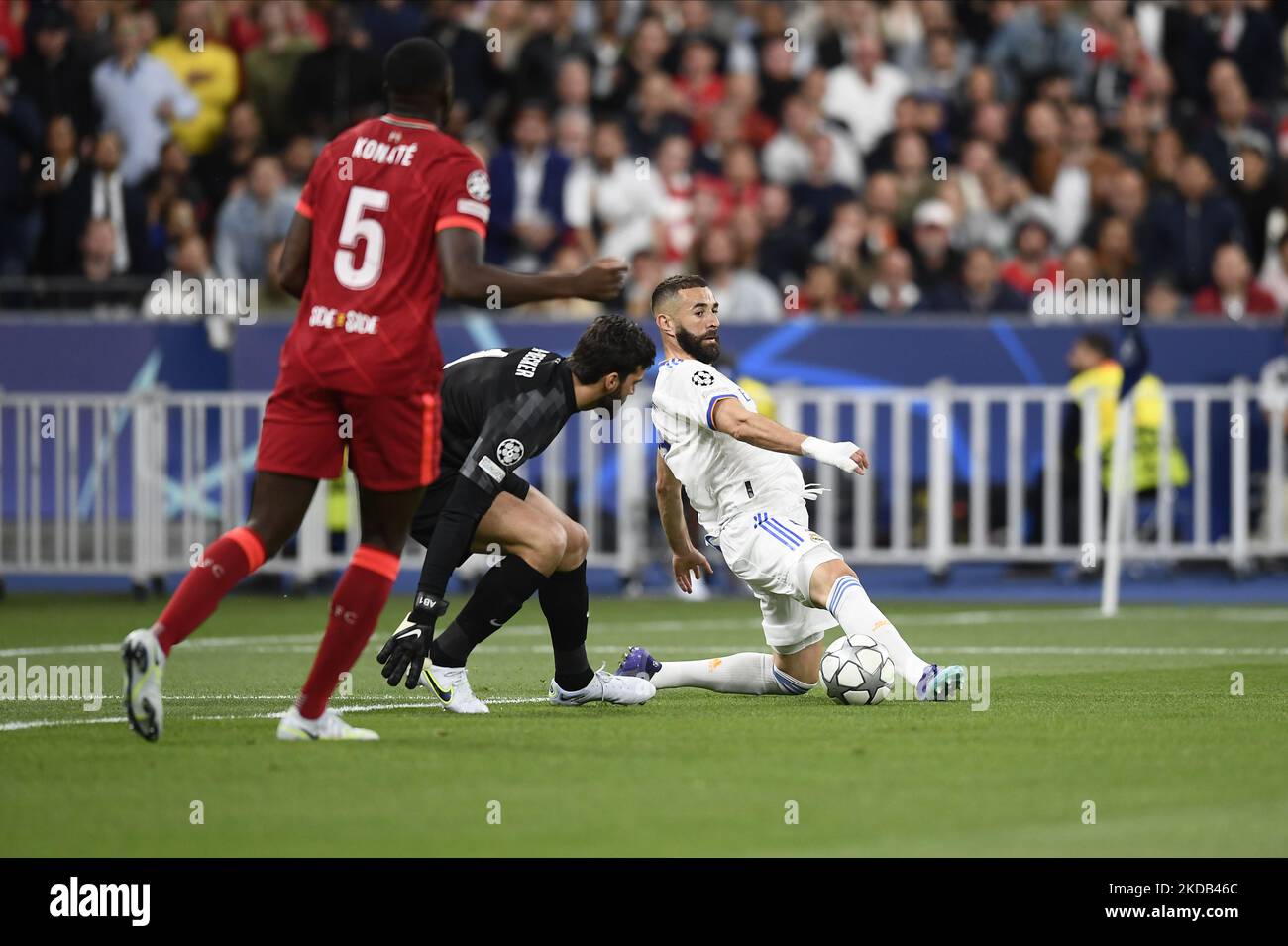 Karim Benzema of Real Madrid,Alisson Becker of Liverpool during the ...