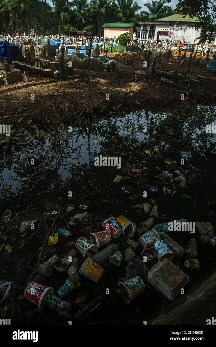 Plastic snack packaging waste is seen in the drainage flow of the ...