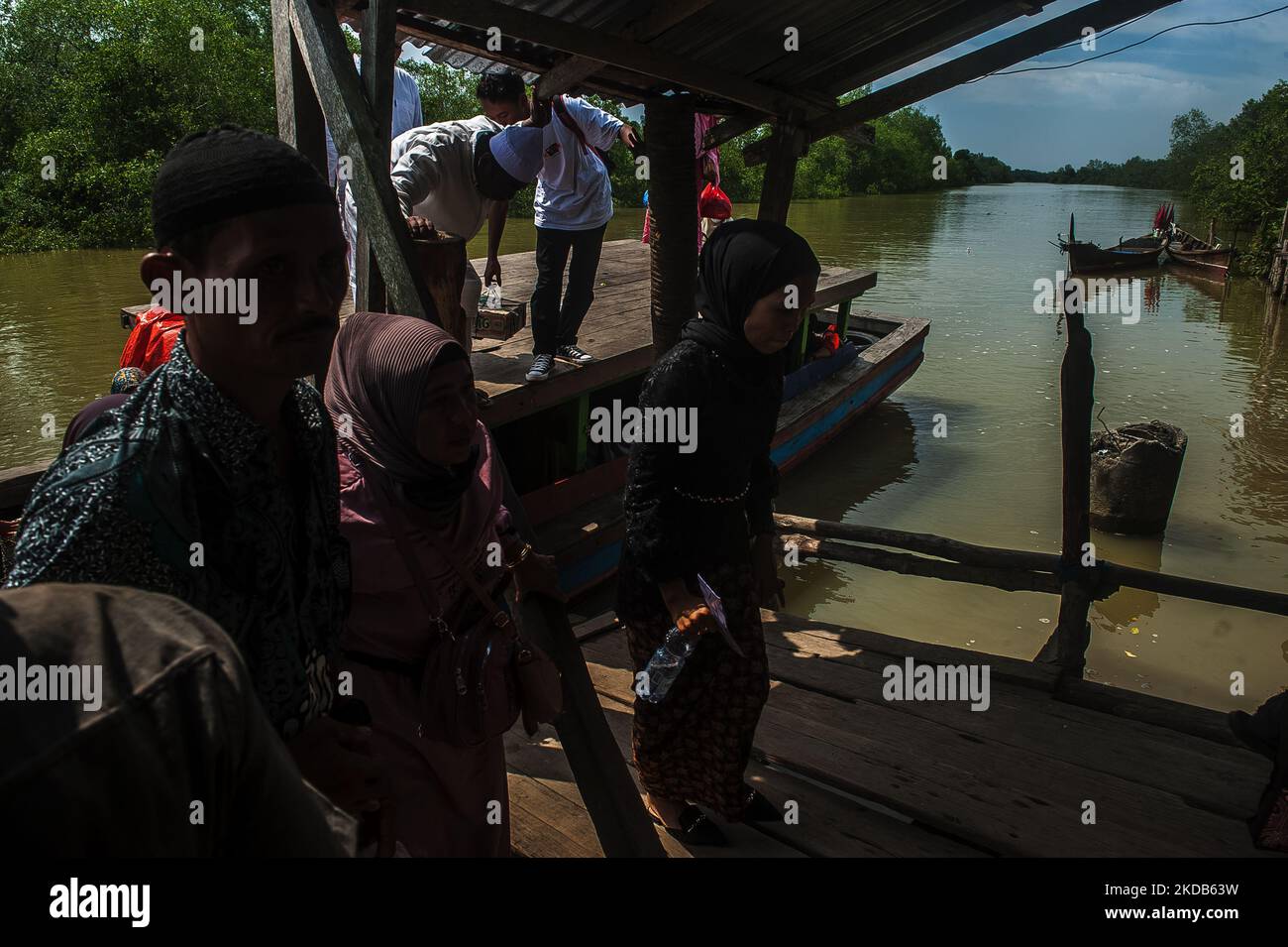 Residents are seen riding water transportation at the Batang Buluh pier ...