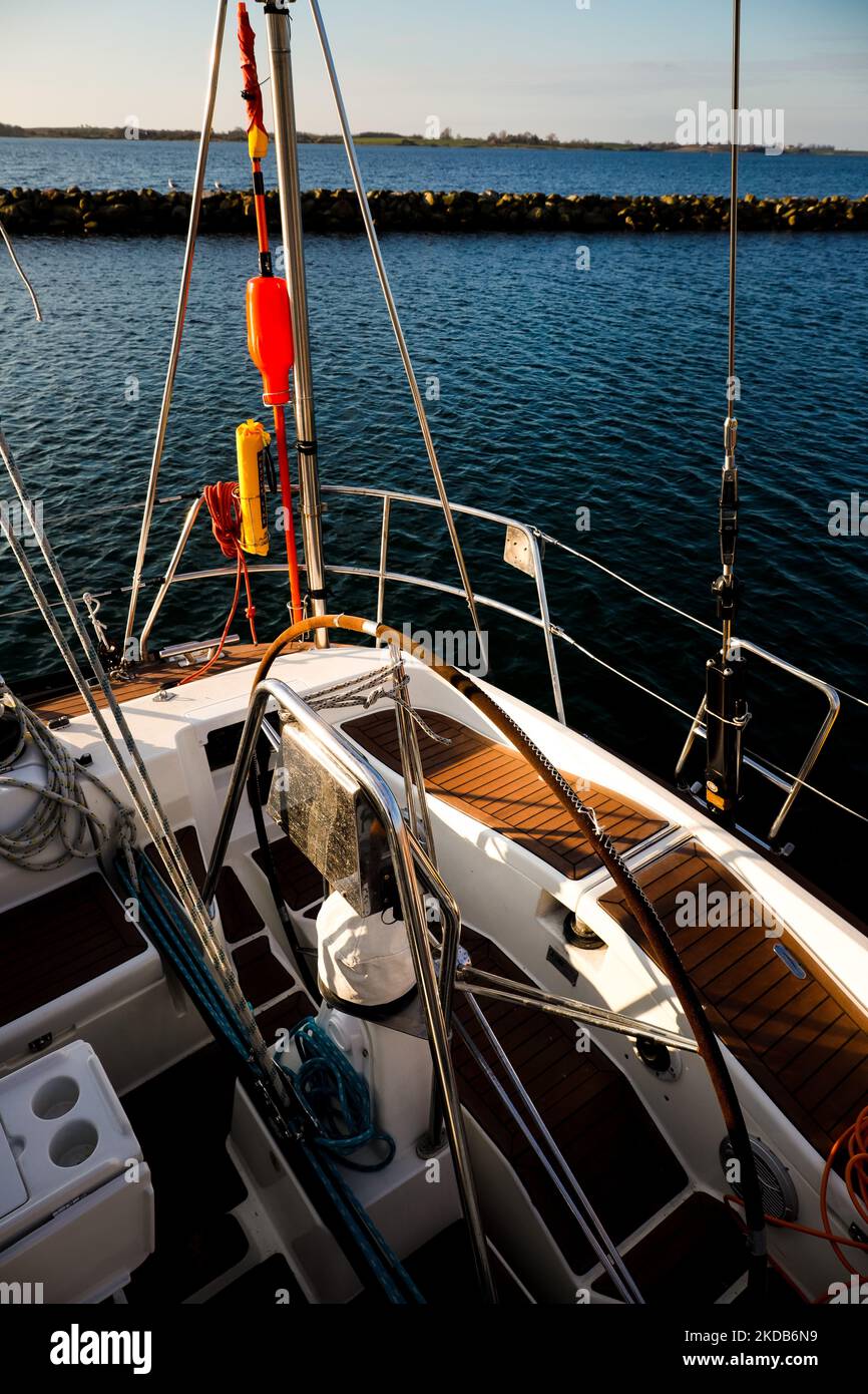 A vertical high angle shot of a luxury boat floating on the water in ...