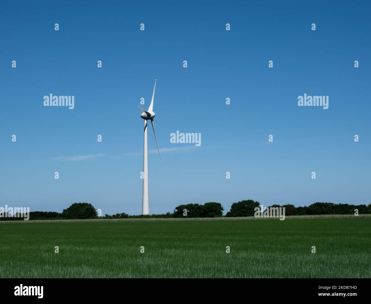 A wind farm of 8 wind turbines near the town of Goulien, in Brittany in ...
