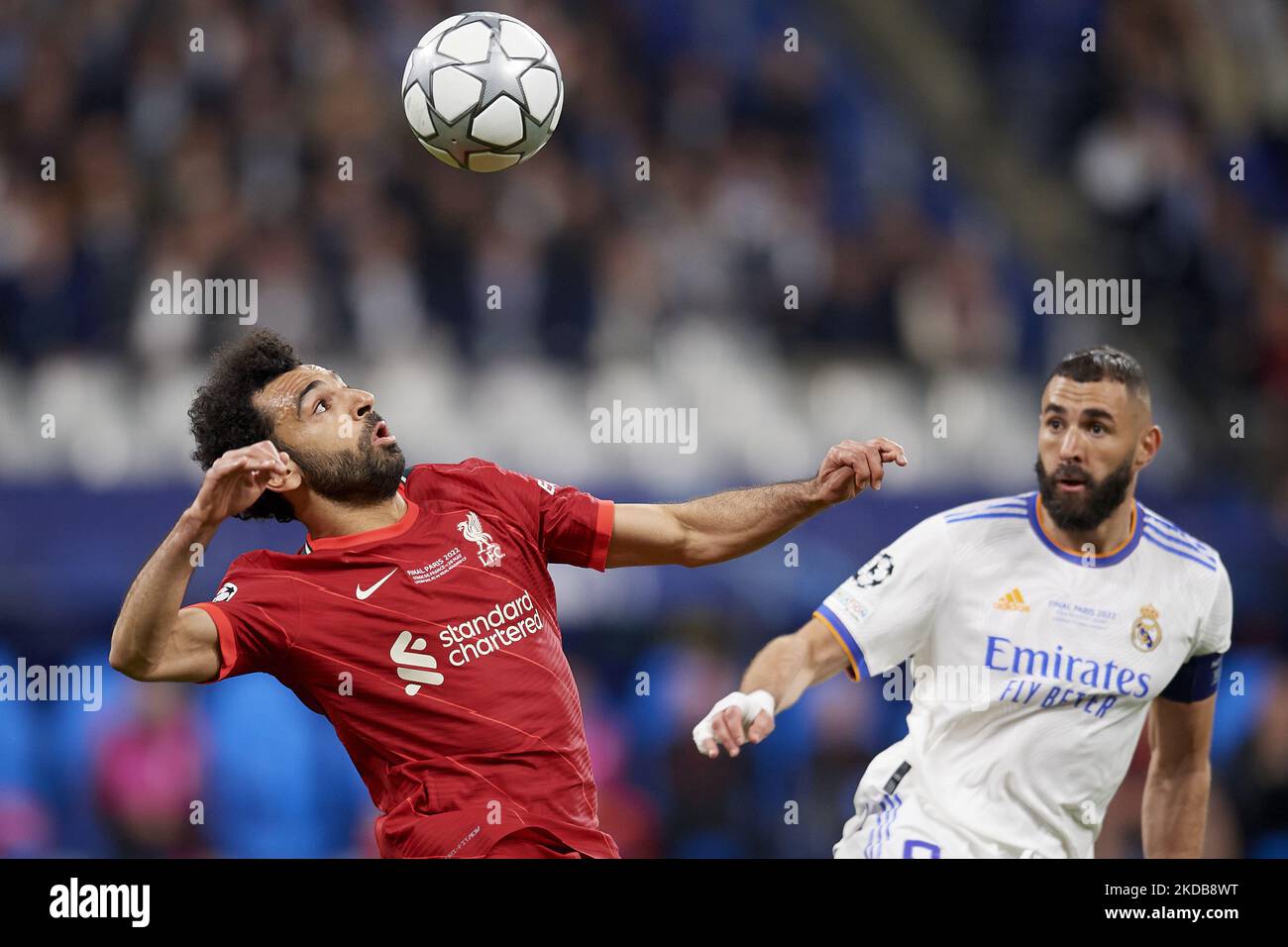 Mohamed Salah of Liverpool and Karim Benzema of Real Madrid compete for the ball during the UEFA ...