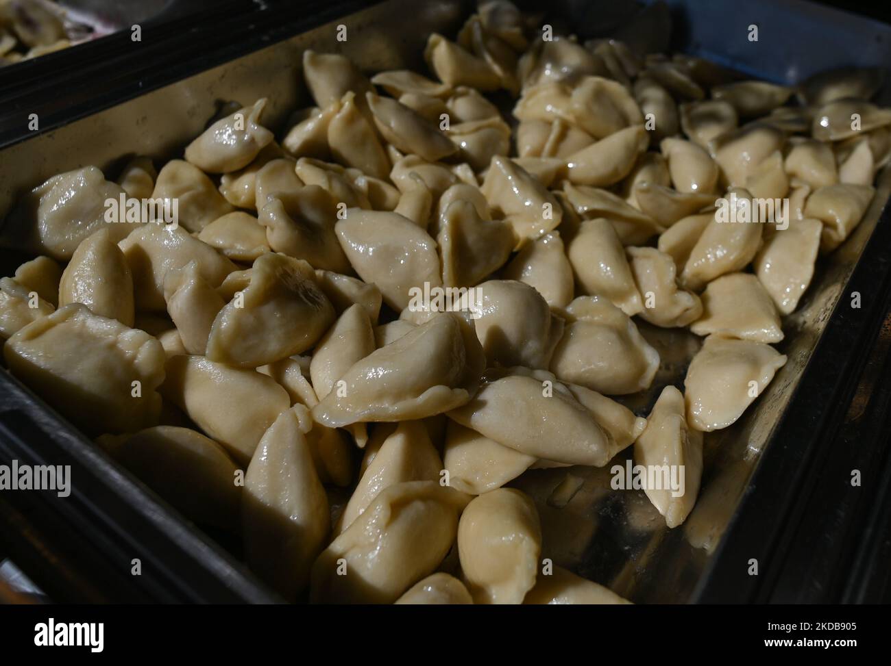 A stand with traditional Polish Pierogi (filled dumplings) for sale. On ...