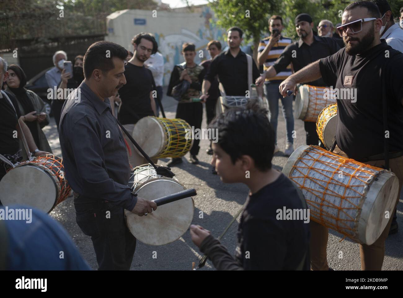 Iranian men play traditional musical instruments while taking part a ...