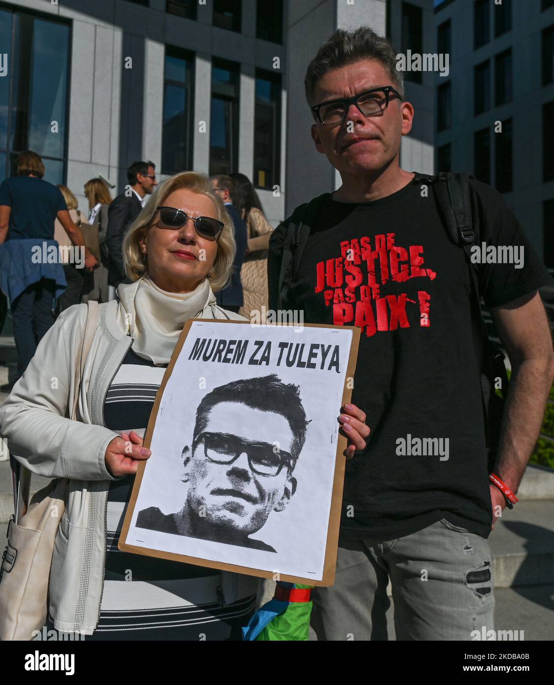 Judge Igor Tuleya (right) poses for a photo with a woman who holds a poster with his image and ...