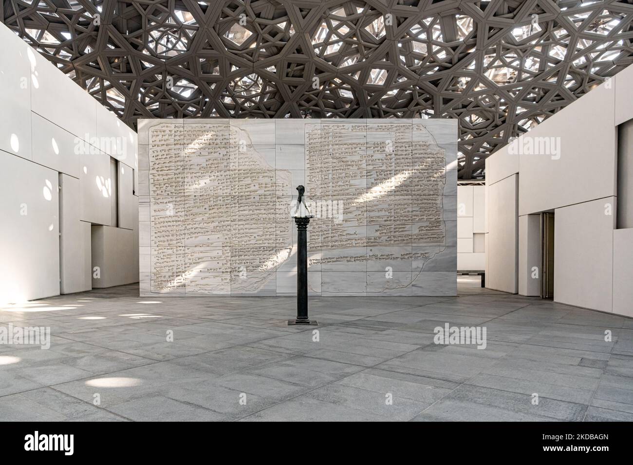 The Walking Man, on a column, by Auguste Rodin at The Louvre, Abu Dhabi ...