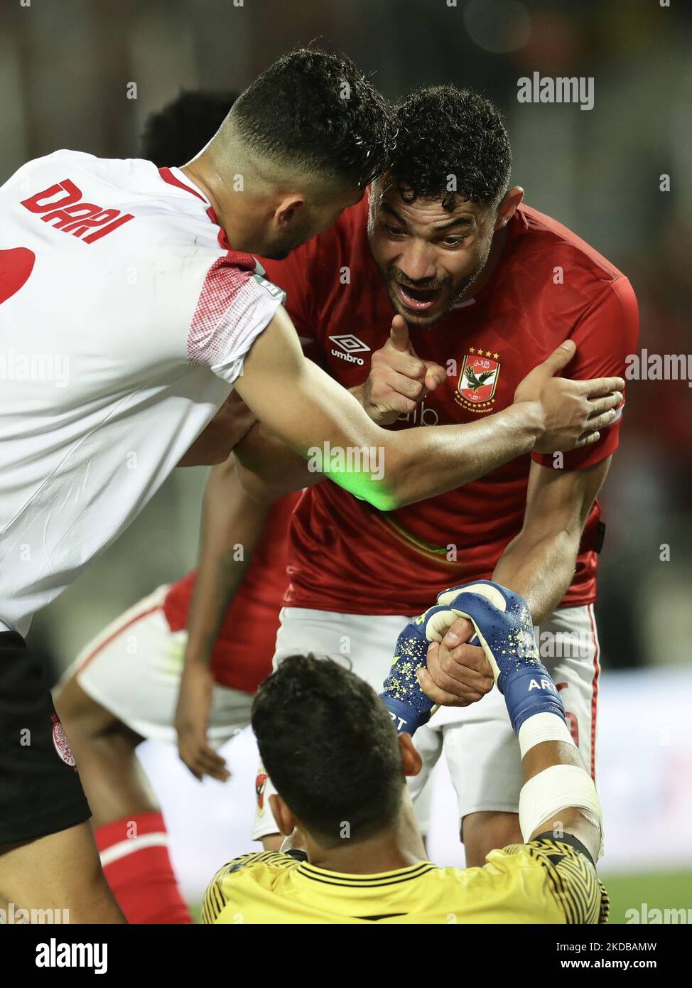 Players of Wydad Casablanca in action against Yasser ibrahem(2nd L) of ...
