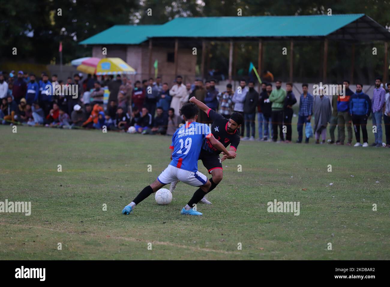 Kashmiri boys play a football match in Sopore District Baramulla, Jammu ...