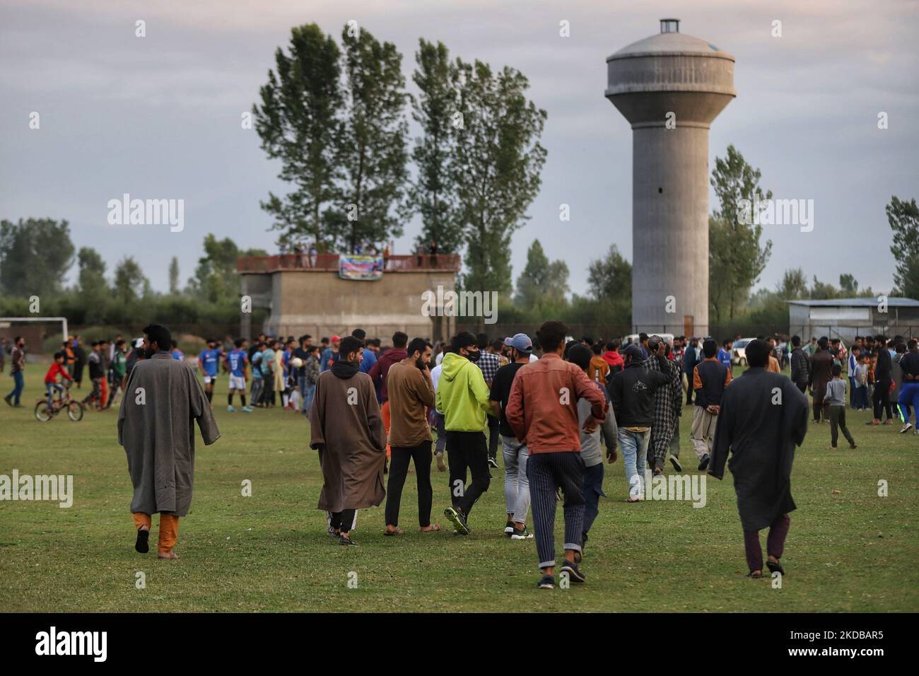 People rush towards the presentation area after a Football match was ...