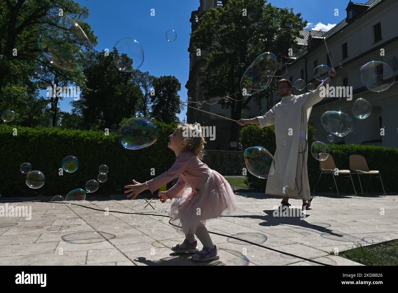A member of the Pauline Fathers commune in Krakow blowing giant soap ...